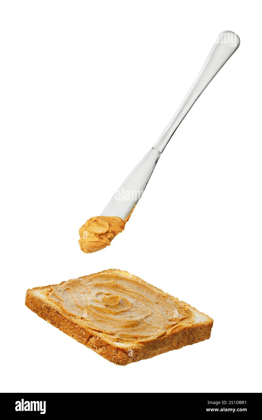 peanut butter falling from knife on toasts Stock Photo - Alamy