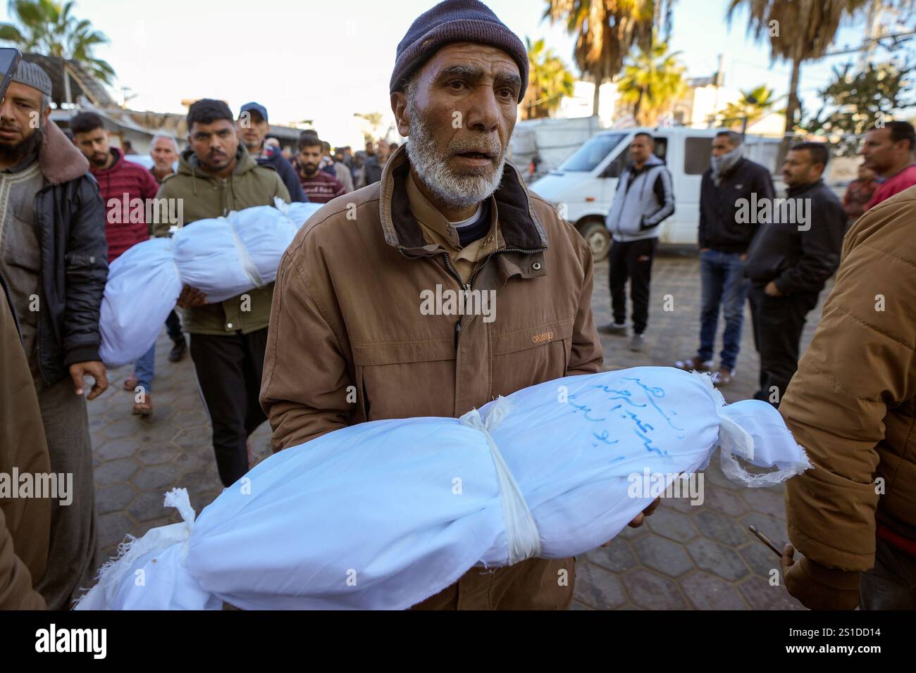 Abdallah Abu Libda carries the body of his 6-month-old nephew, Mohammad ...