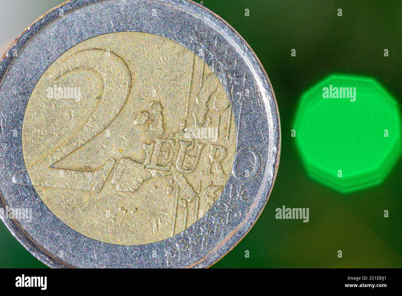 Face of 2 euro coin with blurred green bouquet in the background Stock ...
