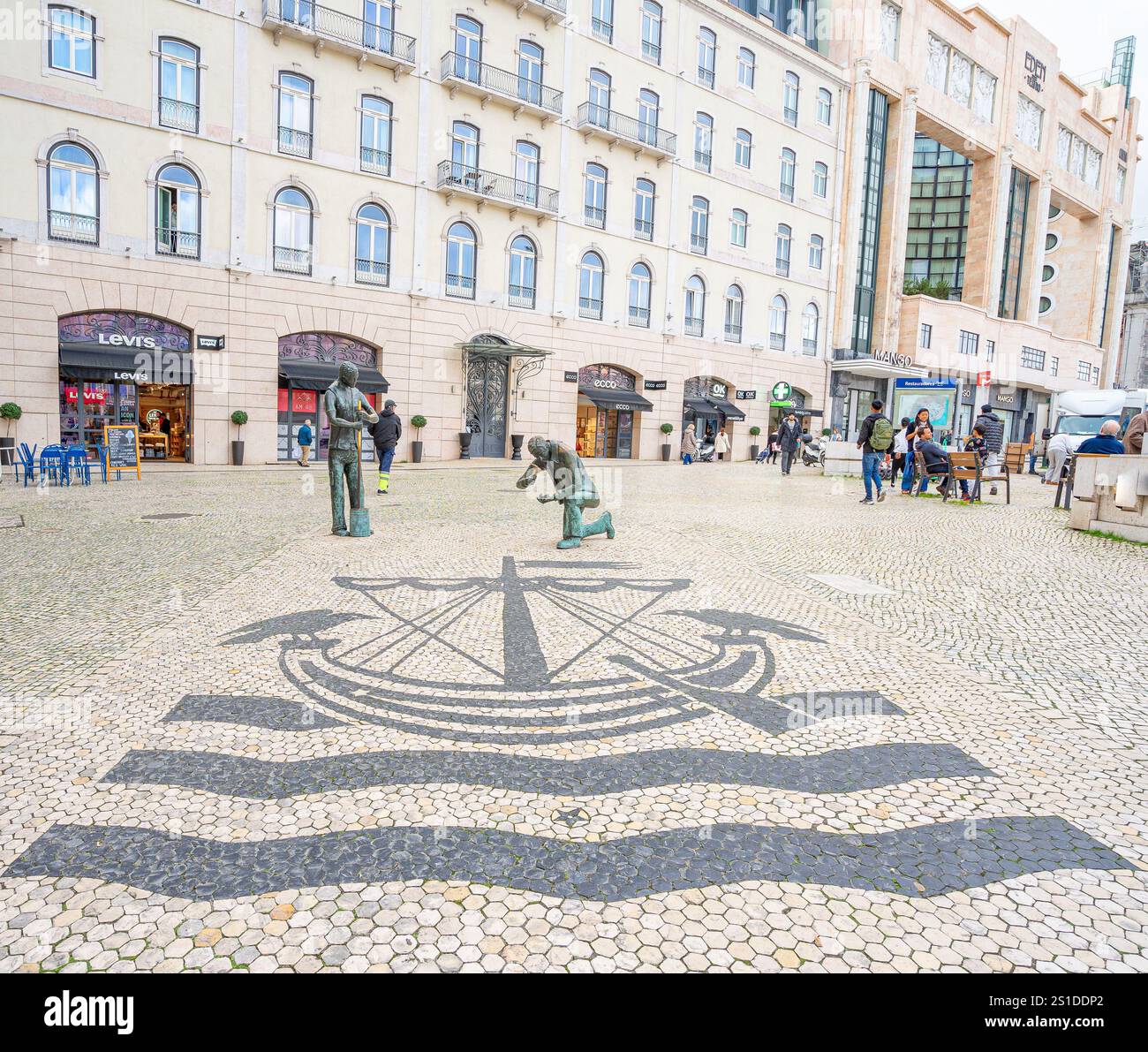 Two metal statues in honor of the pavers who build the ground we walk ...