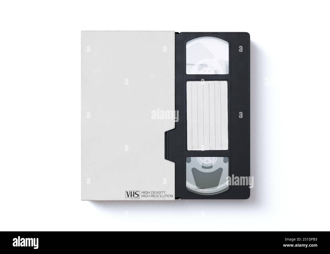 A closeup of a black video cassette analog tape VHS cassette and a ...