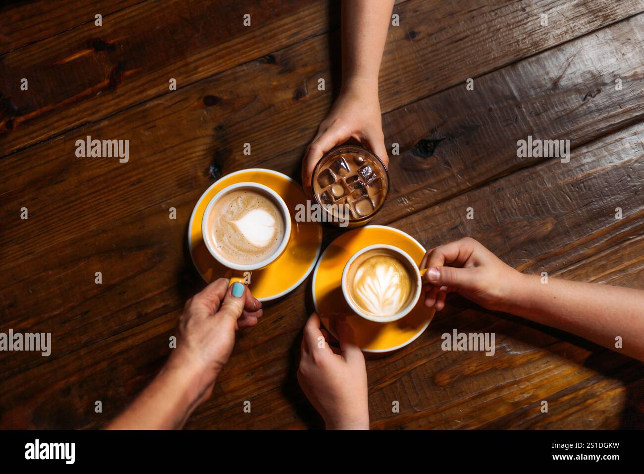 Coffee Cheers with three people Stock Photo - Alamy