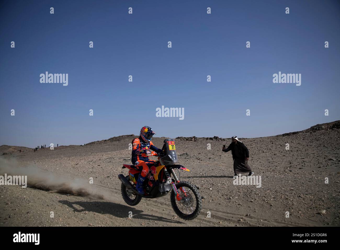 A man takes a photo of Luciano Benavides of Argentina as he rides ...