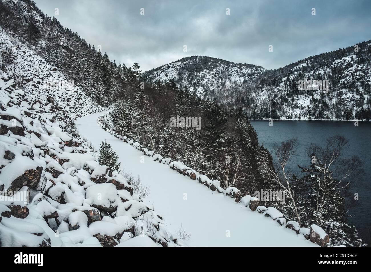 Snow covered carriage trail in winter in Acadia National Park Stock ...