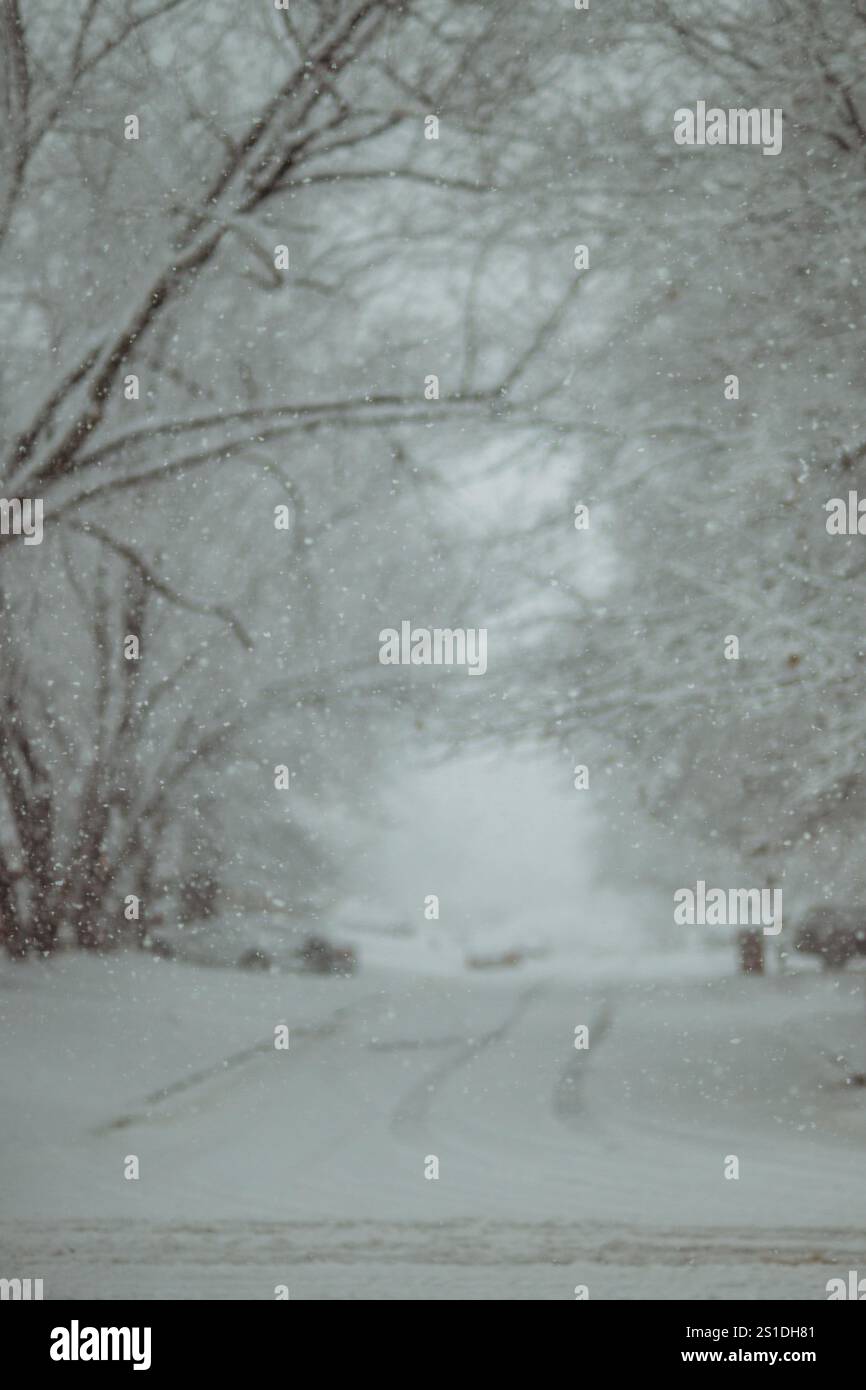 Empty Street covered in snow with Snow falling Stock Photo - Alamy