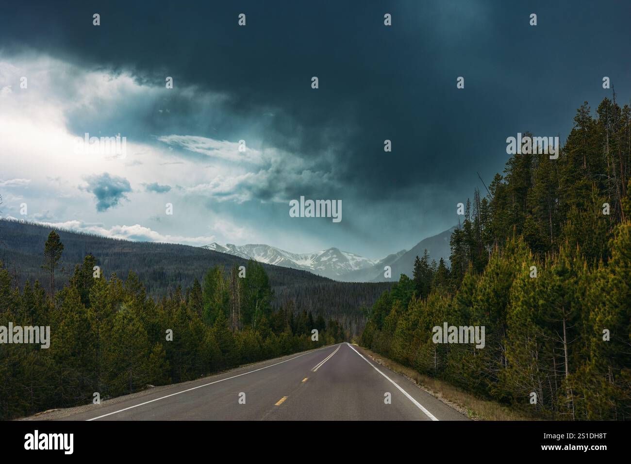 Empty Road leading to mountains in Colorado USA Stock Photo - Alamy