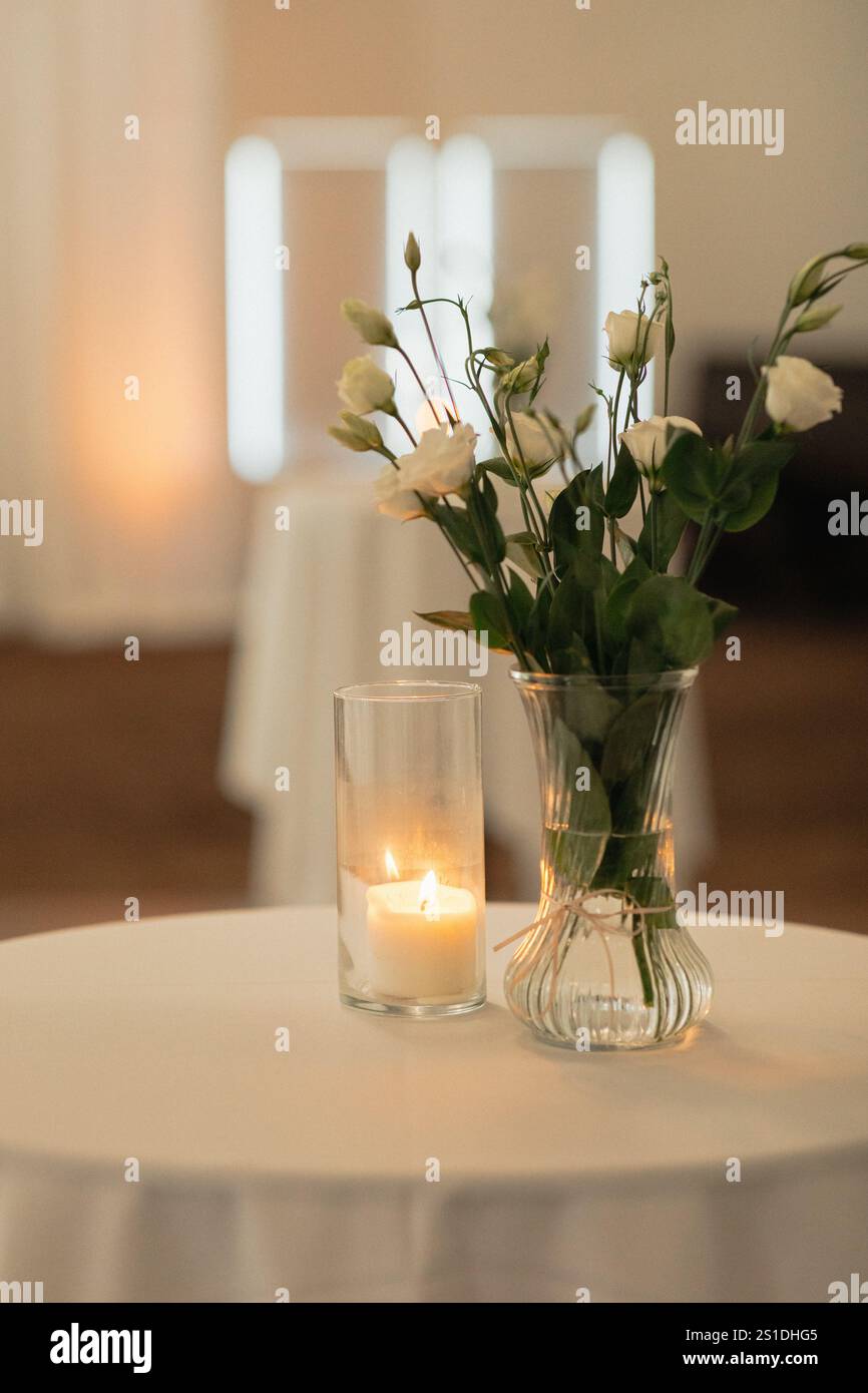 White rose table decor with soft background Stock Photo - Alamy