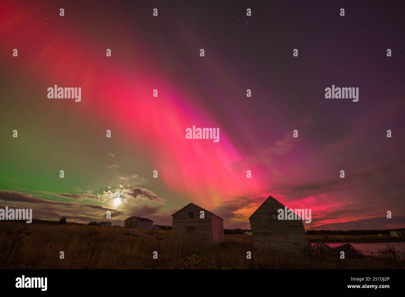 Red Aurora Over Abandoned Sheds Stock Photo - Alamy