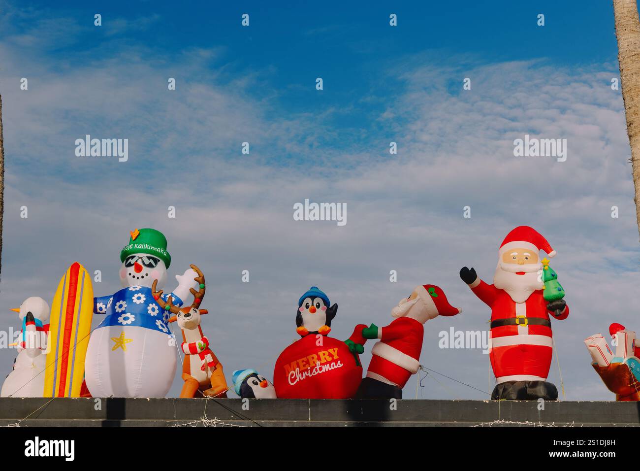 Christmas inflatables on rooftop during the holidays Stock Photo - Alamy
