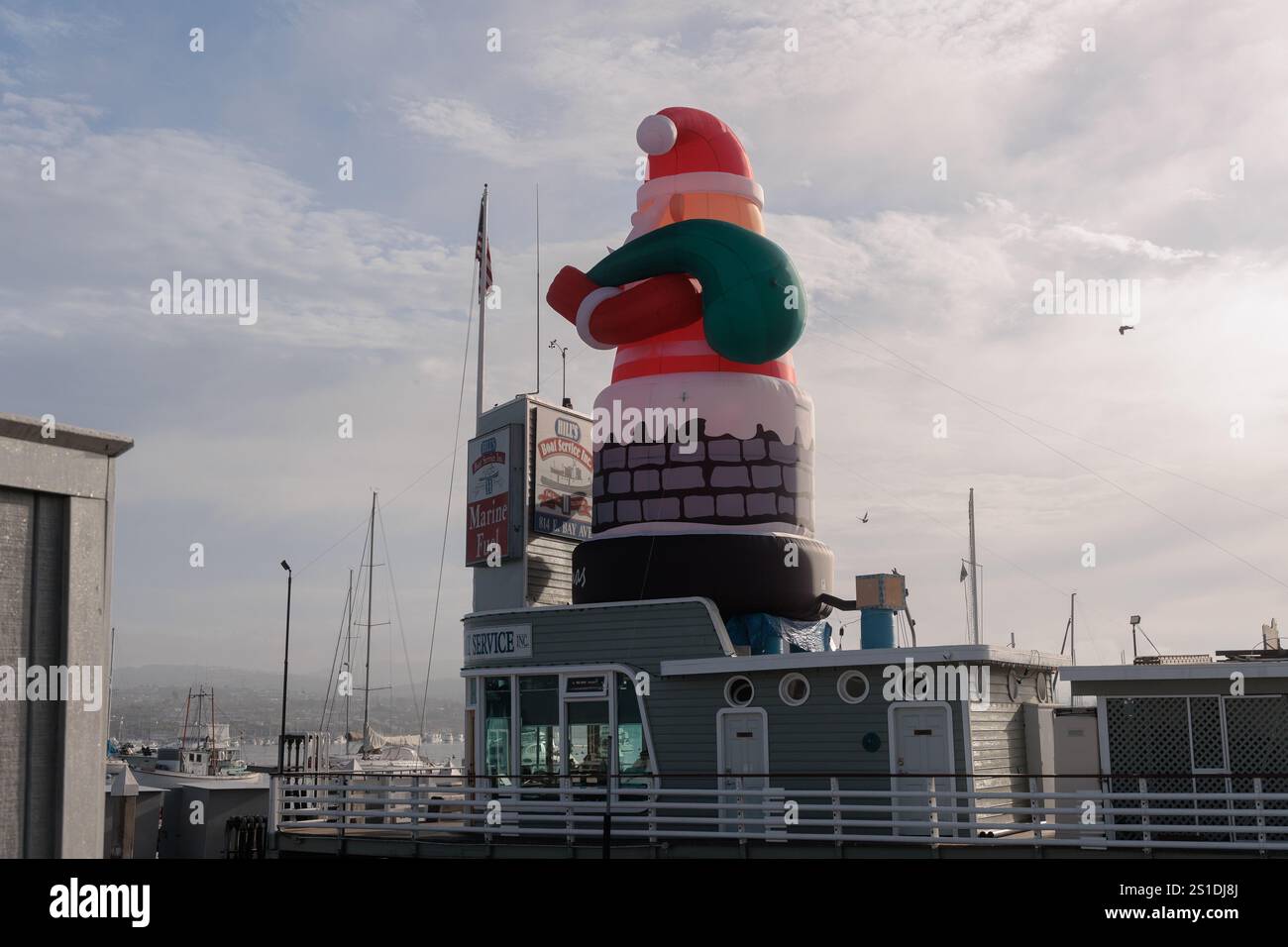 Giant Santa inflatable on building on Newport Peninsula Stock Photo - Alamy