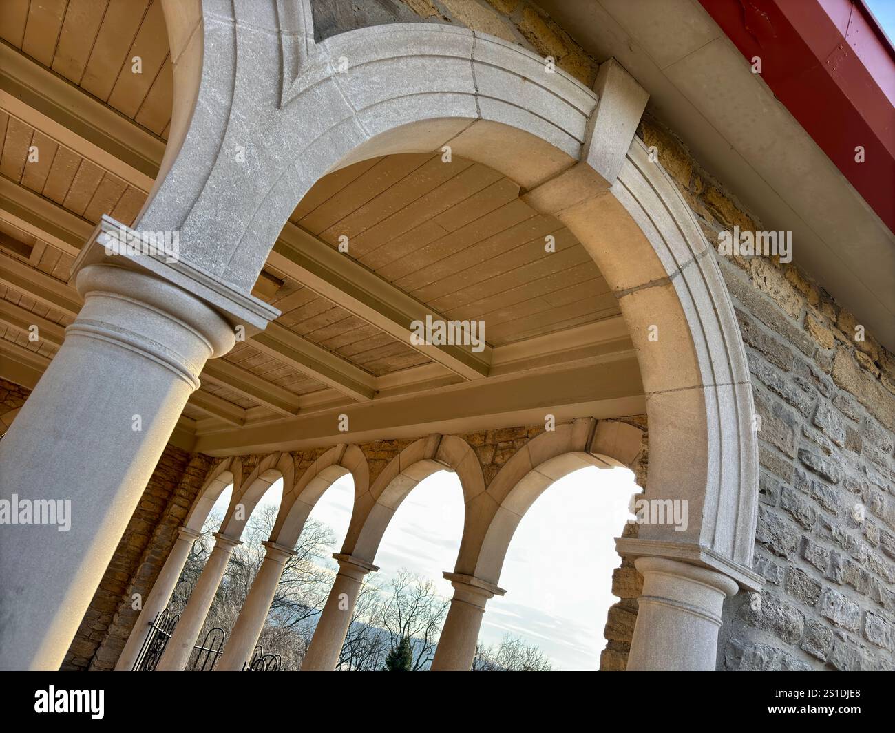 Elegant stone arches and columns with natural light and shadows Stock ...
