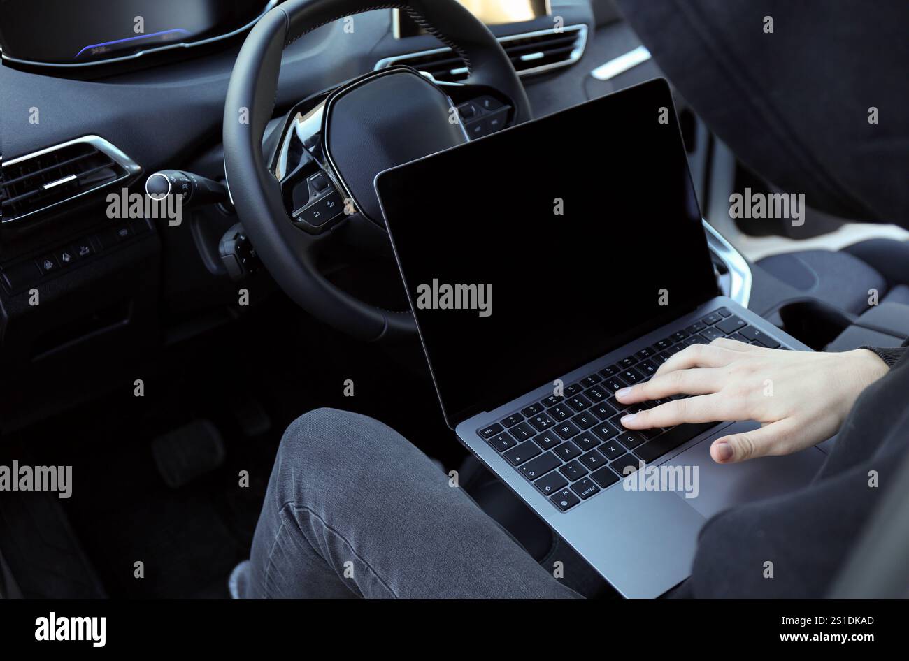 Thief hacking car system with laptop inside vehicle, closeup Stock ...