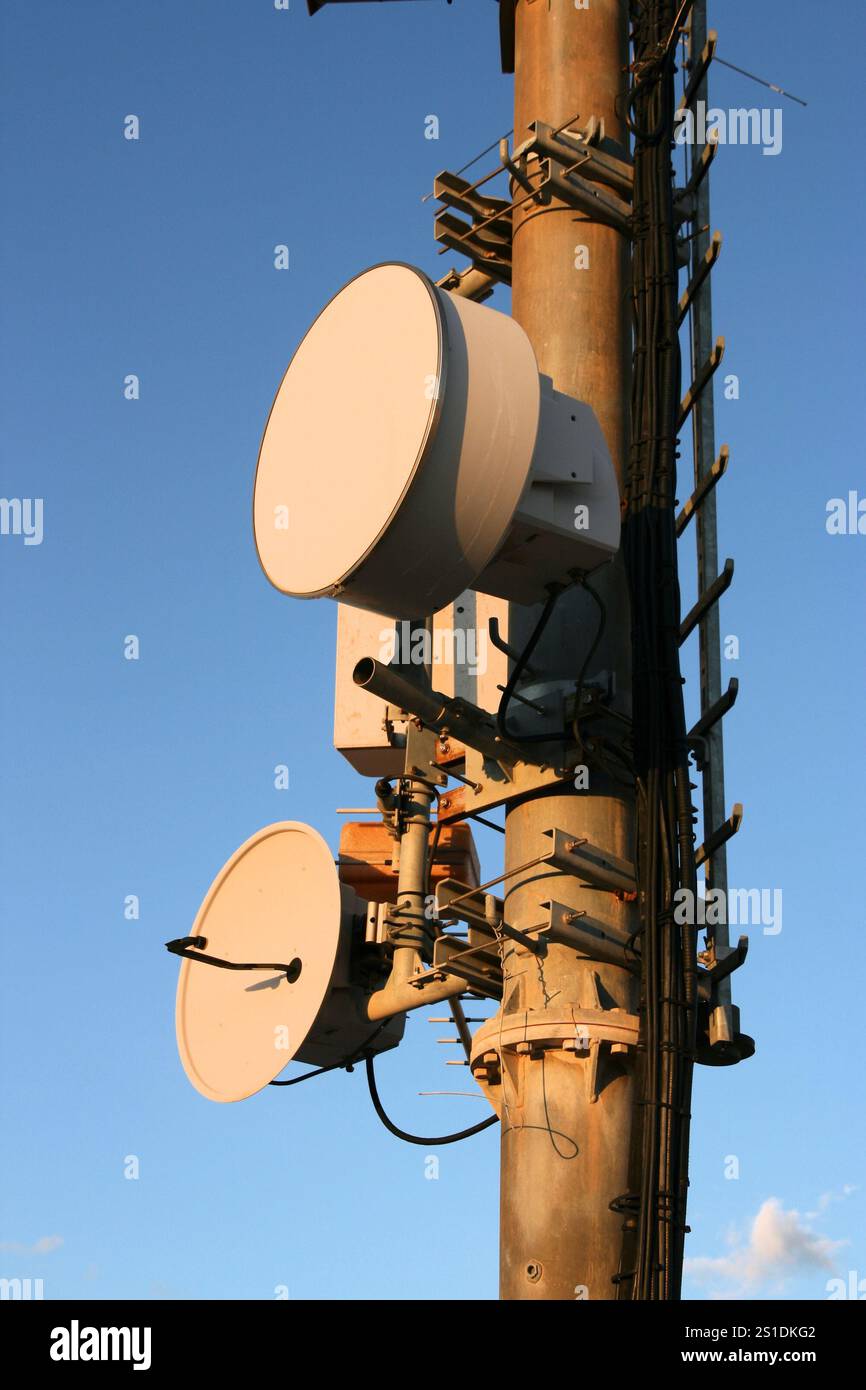 Telecom base station in Spain. Cell tower sector antennas. Mobile transmitter equipment Stock ...