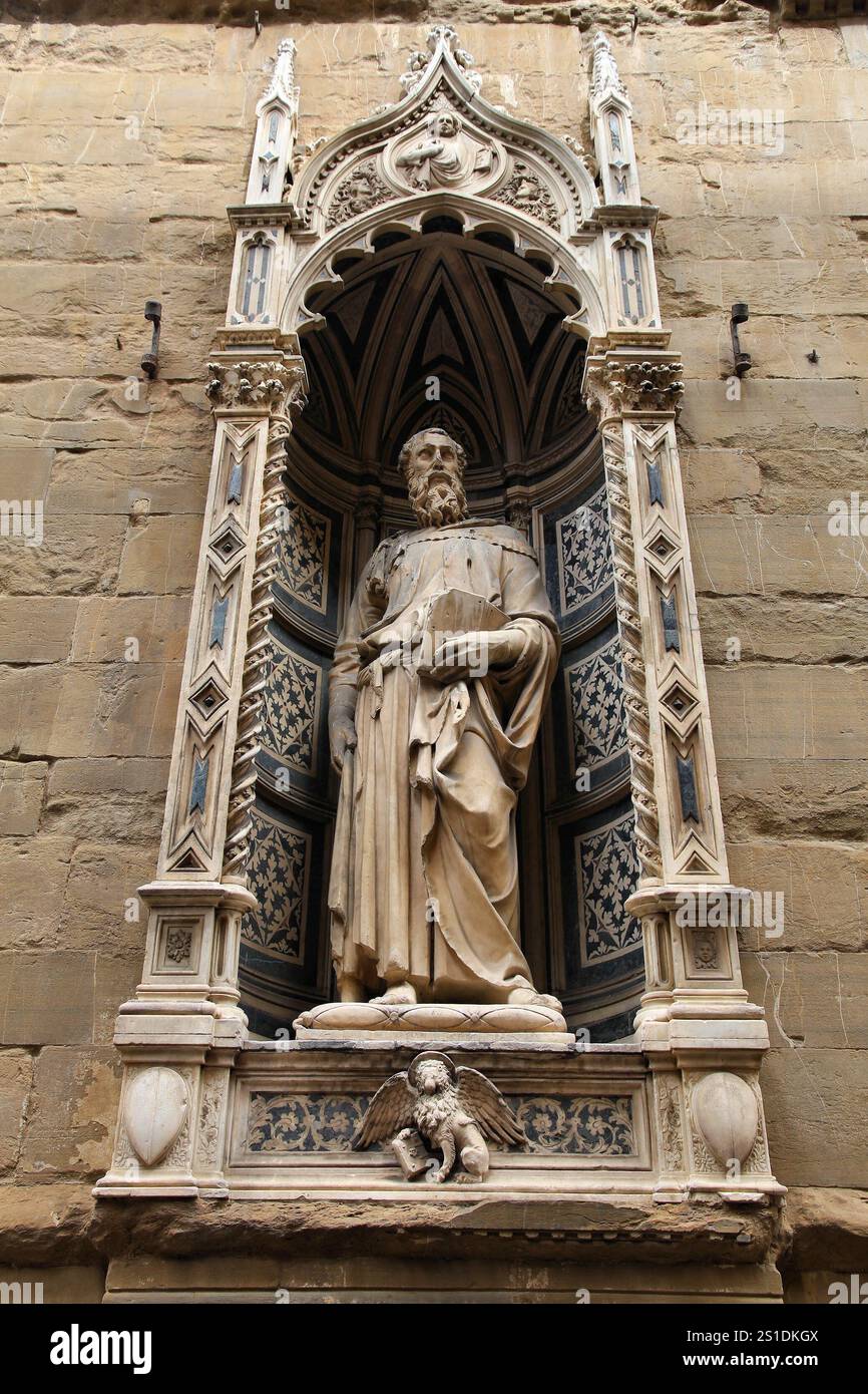 Saint statue of Orsanmichele church facade in Florence, Italy. Saint Mark the Evangelist ...