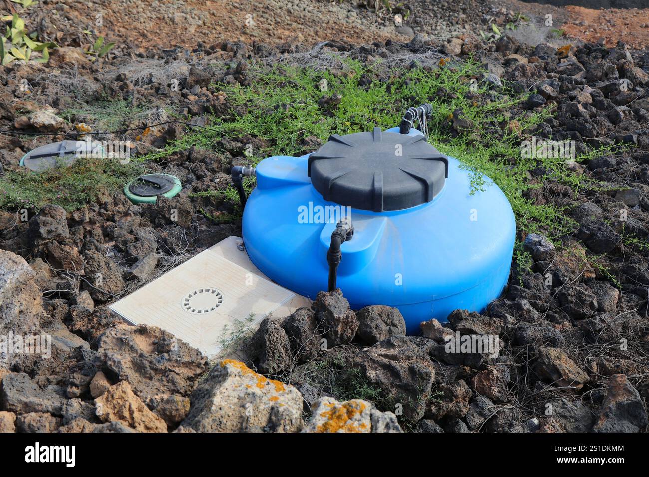 Underground plastic water tank in volcanic landscape of Fuerteventura ...