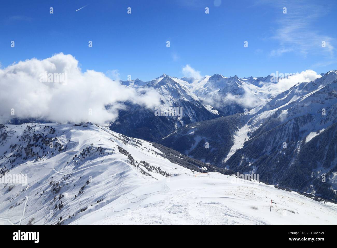 Austrian Alps landscape in winter. Mountains hidden in clouds in ...