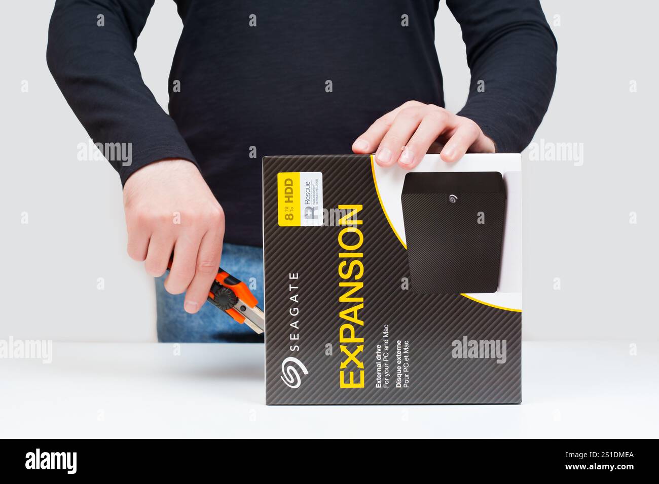 Kyiv, Ukraine - October 23, 2024: Person holding Seagate Expansion ...