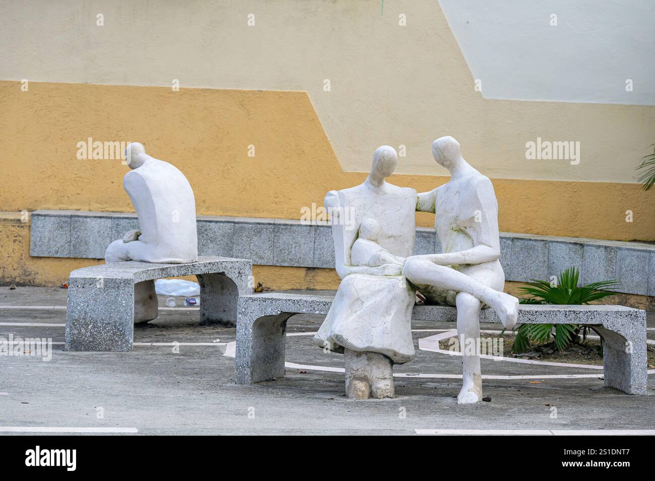 Decorative cement sculptures in a parkette at an intersection on ...
