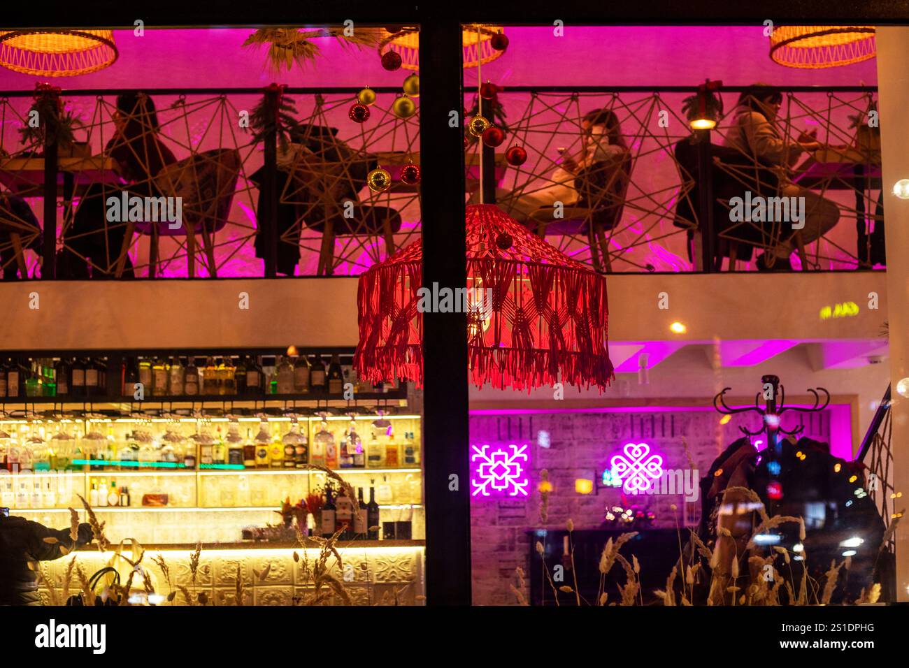 two-story cafe with festive decorative lighting Stock Photo - Alamy