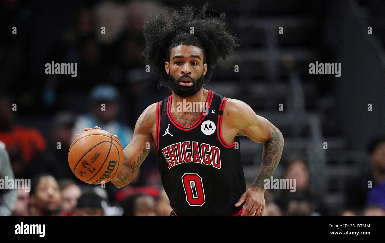 Chicago Bulls guard Coby White (0) brings the ball up court against the ...