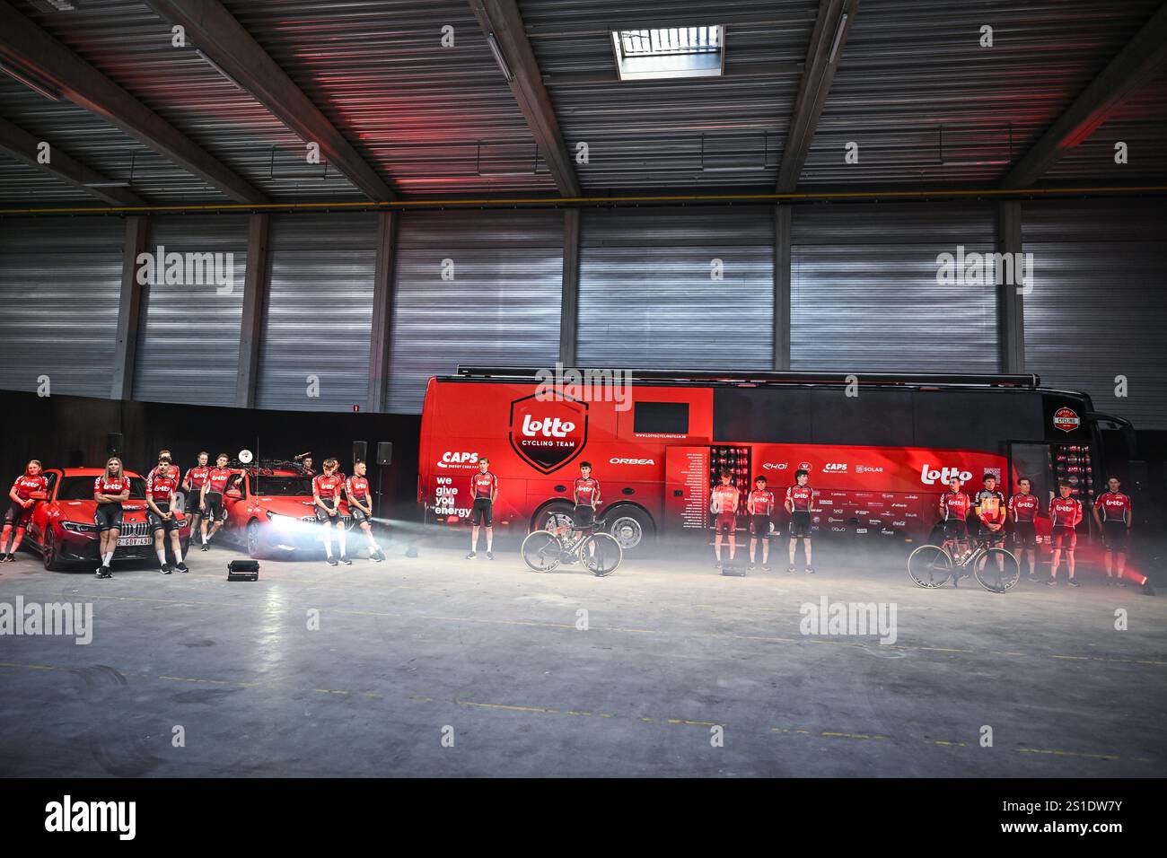 Temse, Belgium. 03rd Jan, 2024. Lotto Cycling Team cars and bus and ...