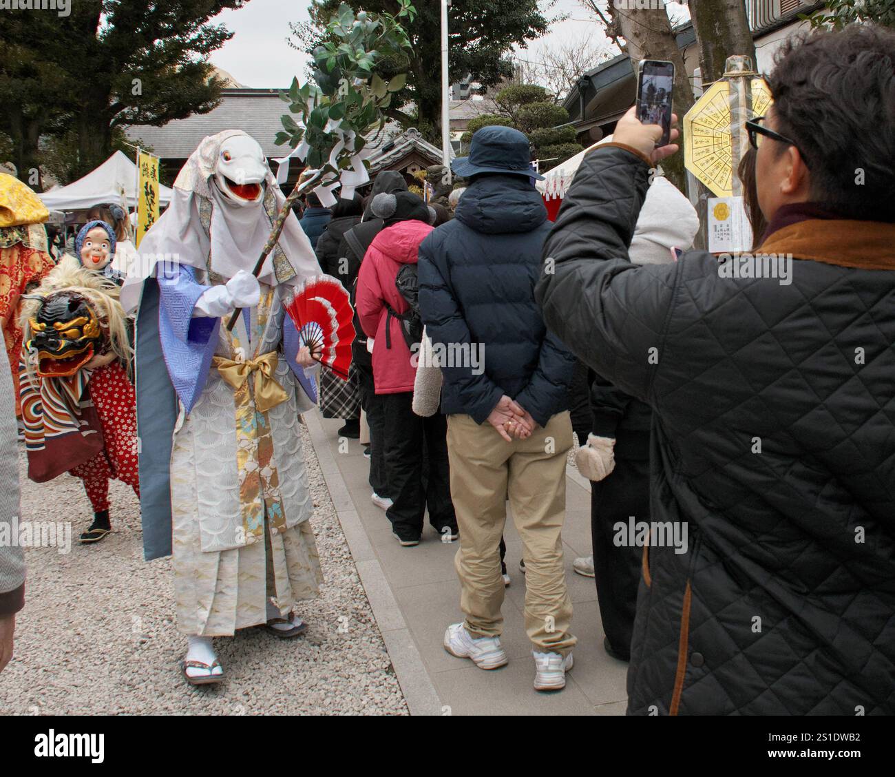 Tokyo, Japan. 03rd Jan, 2025. Performer wearing a white snake mask ...