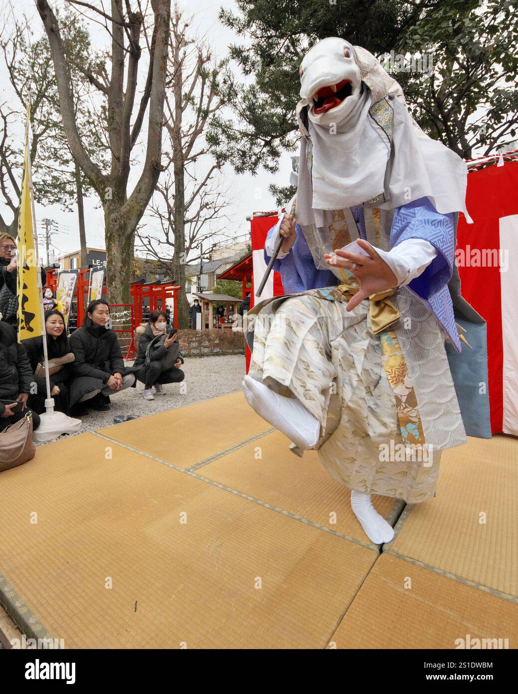 Tokyo, Japan. 03rd Jan, 2025. Performer wearing a white snake mask ...
