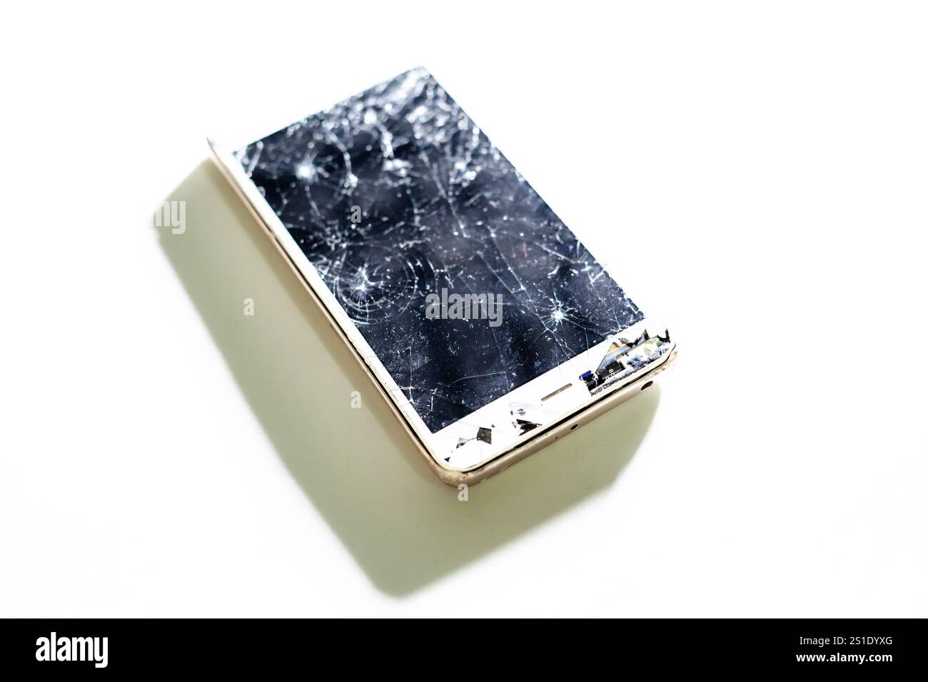 Black broken touch screen phone with cracked screen. Smashed glass ...