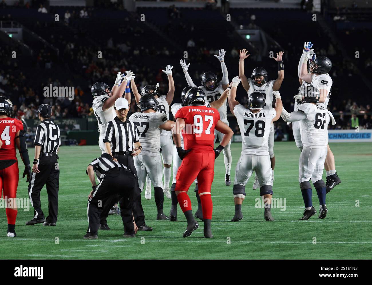 Members of Panasonic Impulse celebrate after winning Rice Bowl match ...