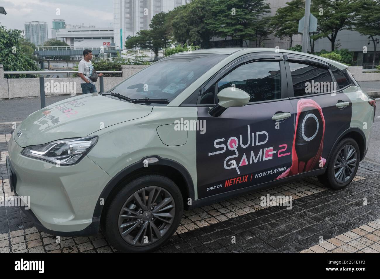 A car with Squid Games advertisement seen passing by at Central Market ...