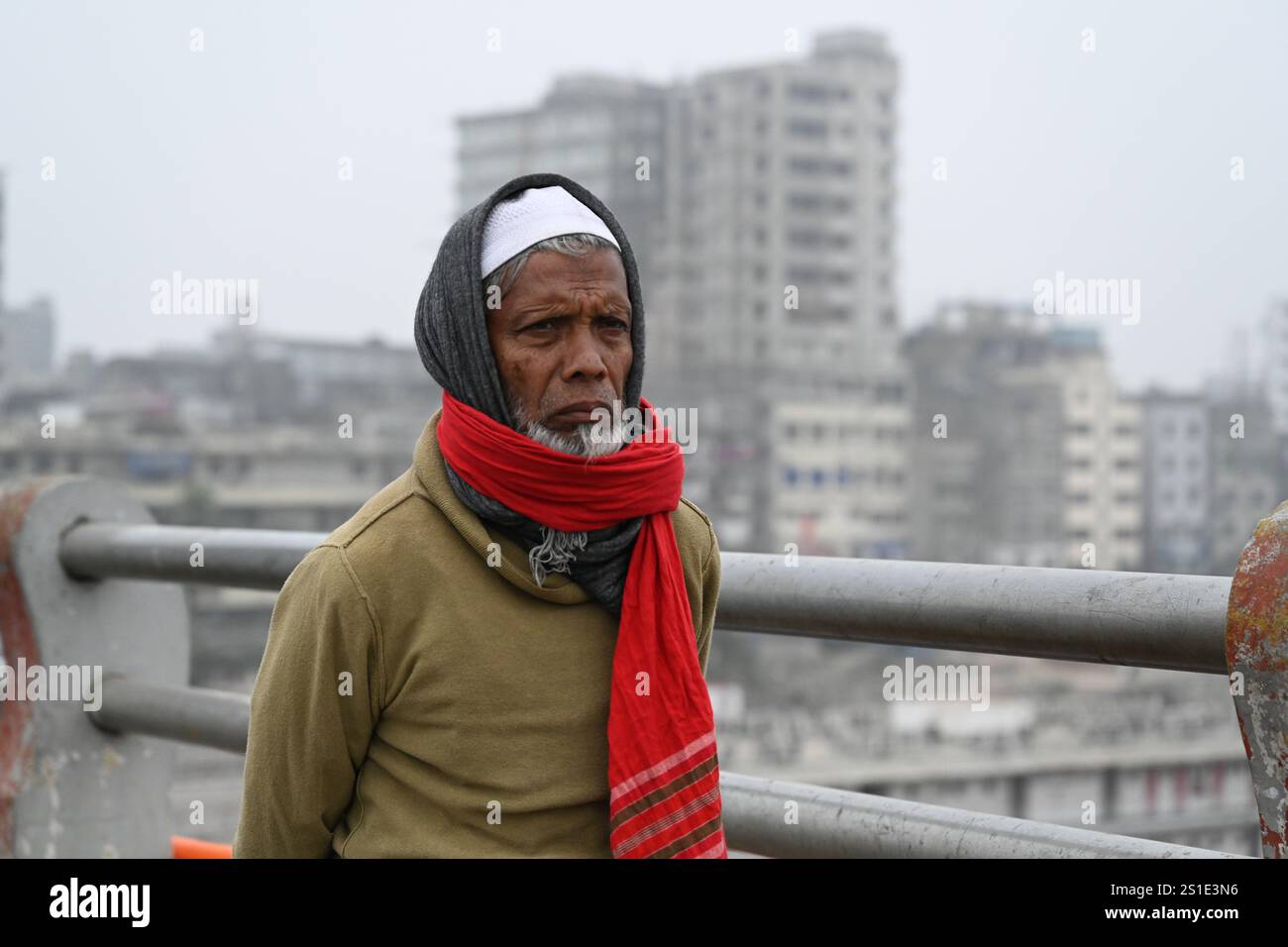 People are wearing winter clothes as they moves on the street due to ...