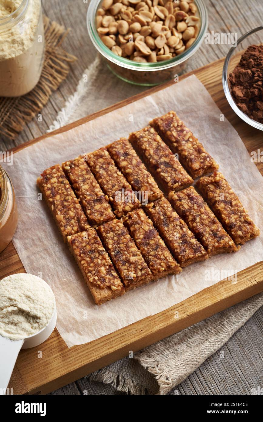 Homemade healthy bars made of whey protein powder, peanut butter, dates ...