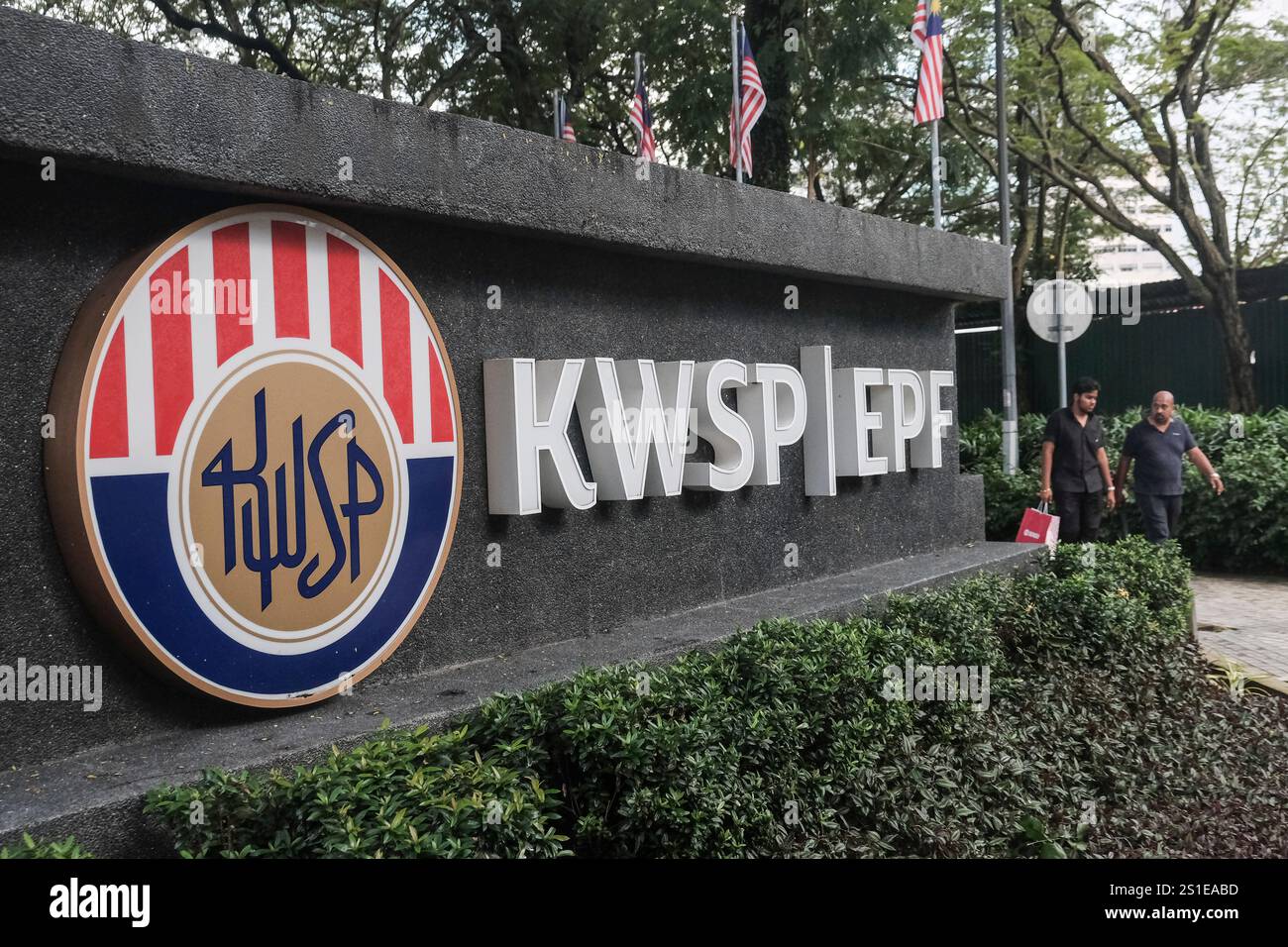 Kuala Lumpur, Malaysia. 29th Dec, 2024. People seen passing by the ...