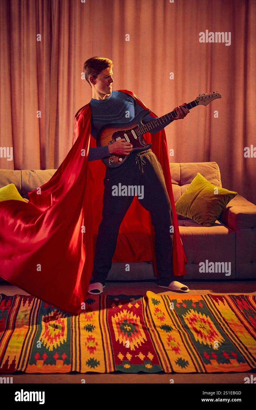 Standing tall with guitar in hand, man dressed as superhero strikes ...