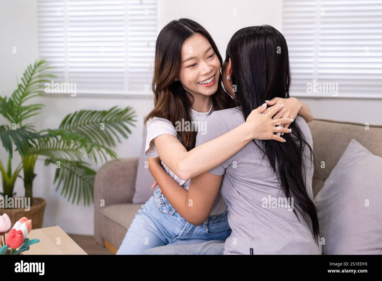 Two friends sharing an emotional moment, hugging each other in joy, celebrating their connection ...