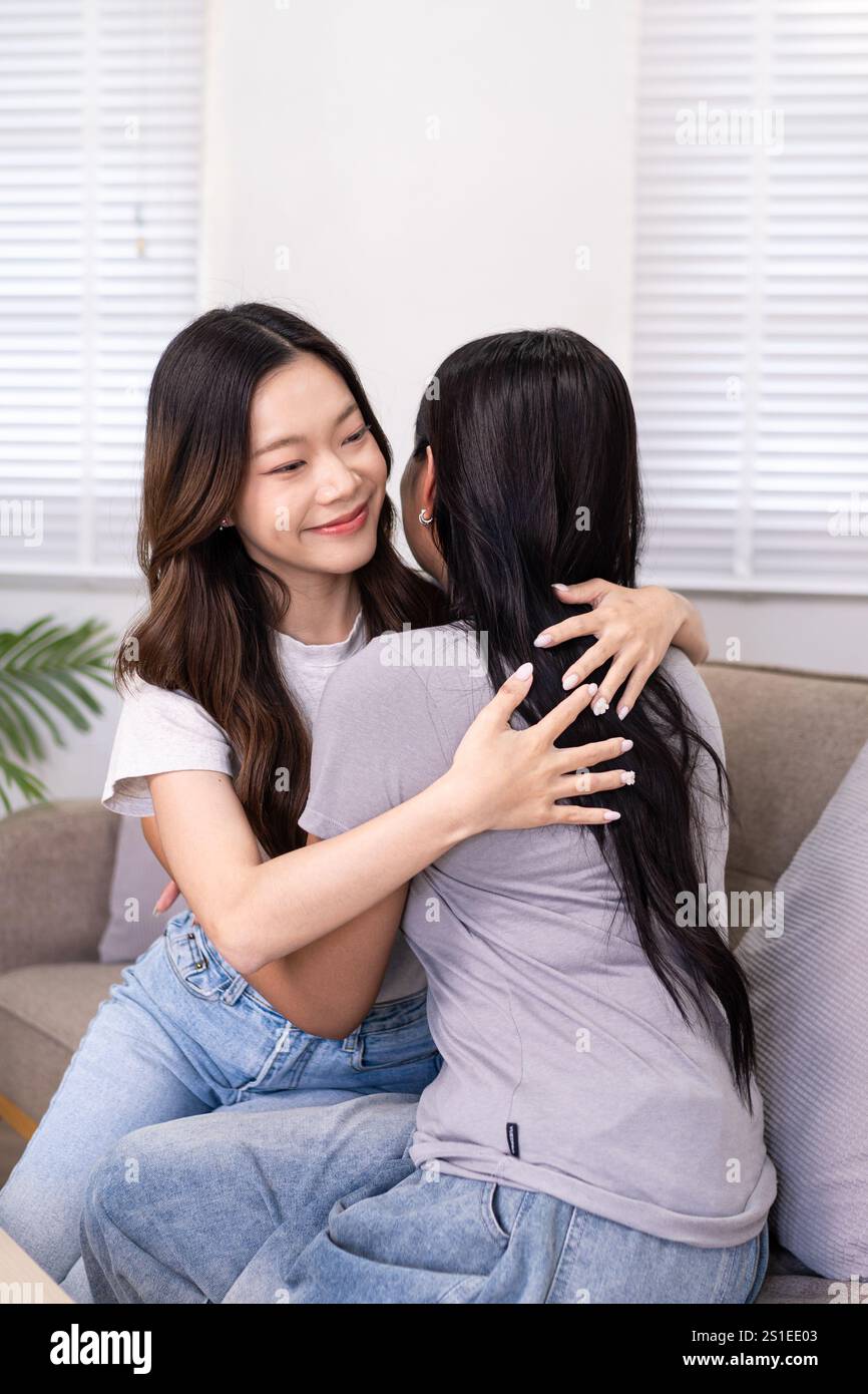 Two friends sharing an emotional moment, hugging each other in joy ...