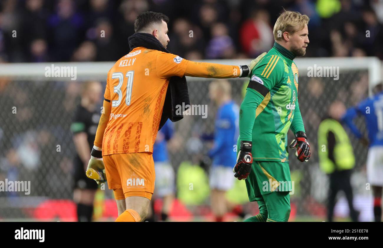 Celtic goalkeeper Kasper Schmeichel being consoled Rangers goalkeeper ...