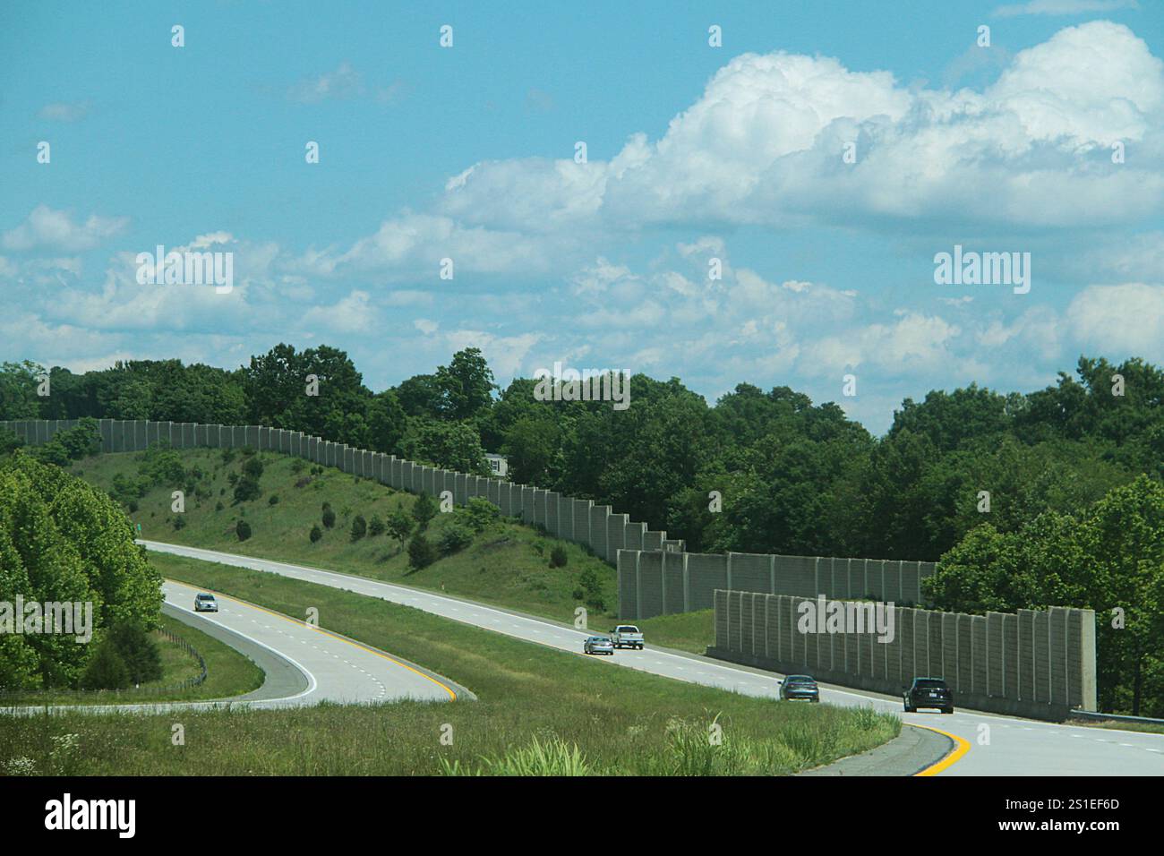 Divided highway with a noise barrier wall in the USA Stock Photo - Alamy