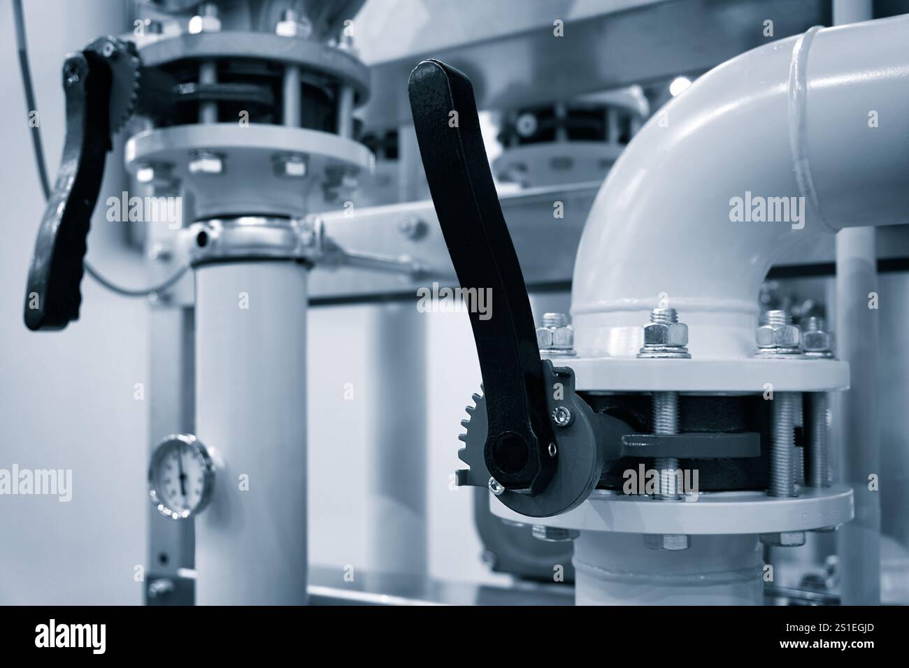 The gas pipeline is yellow with additional equipment, pipes and a valve to shut off the gas ...