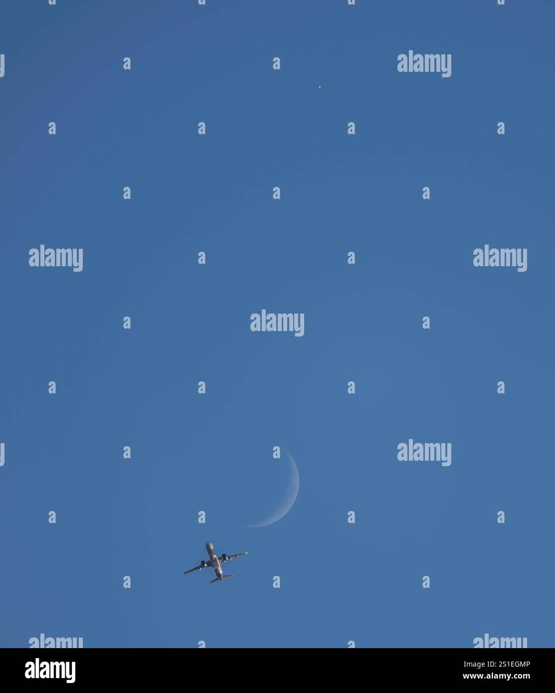 London, UK. 3rd Jan, 2024. The crescent Moon appears close to and below ...