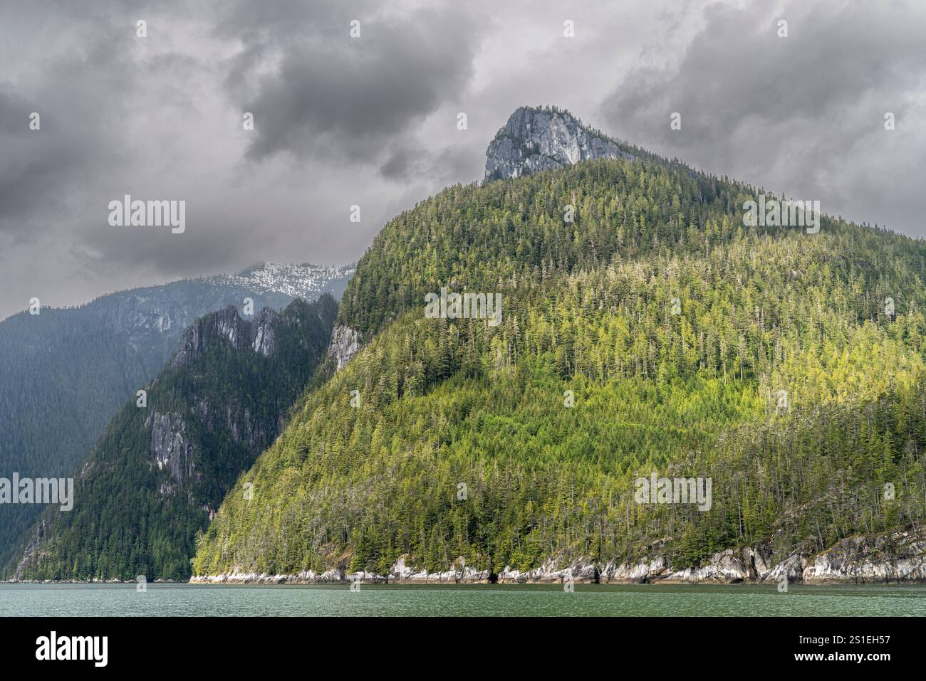 Storm brewing above the towering cliffs of Knight Inlet, Traditional ...