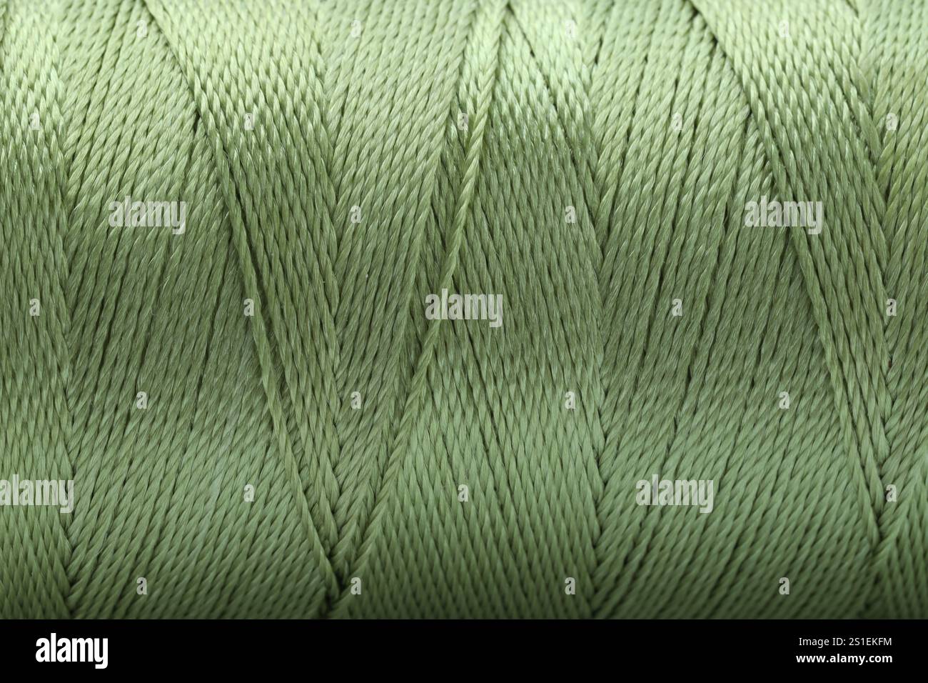 Beautiful olive sewing thread as background, closeup Stock Photo - Alamy