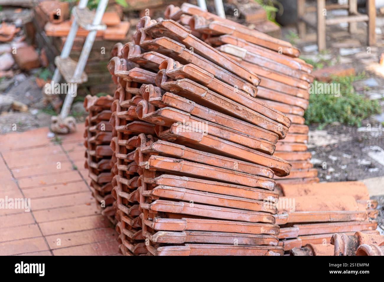 Pile of old clay tiles in a masonry renovation space Stock Photo - Alamy