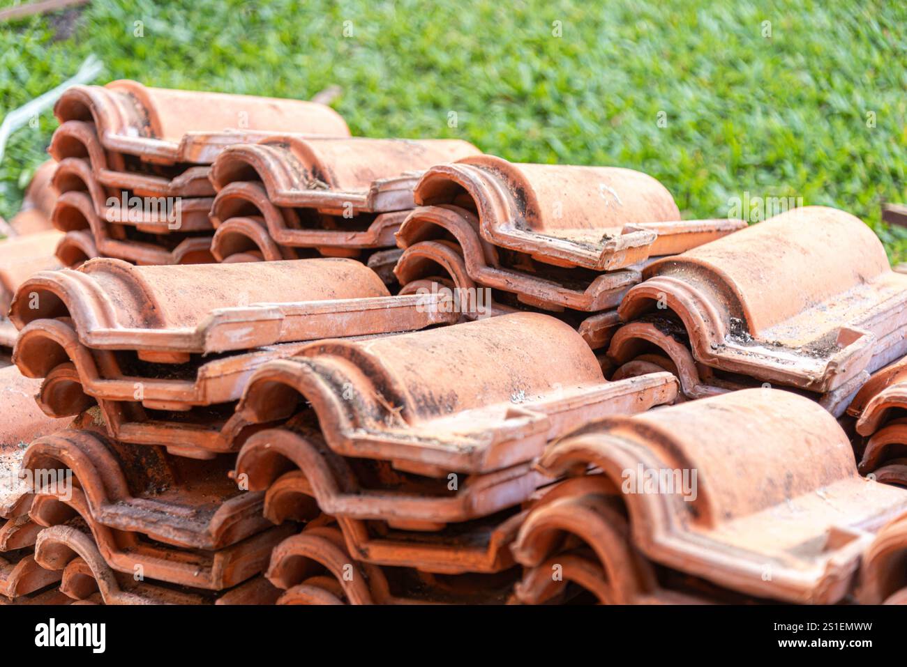 Pile of old clay tiles in a masonry renovation space Stock Photo - Alamy