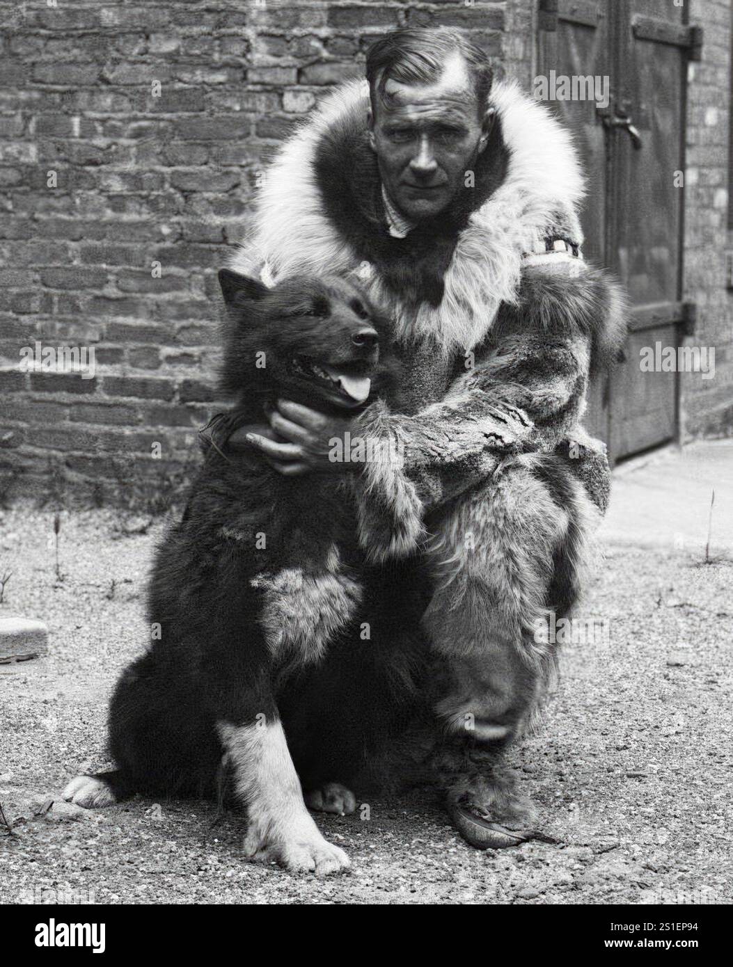 Gunnar Kaasen with sled dog Balto. Members of the last dog team that ...
