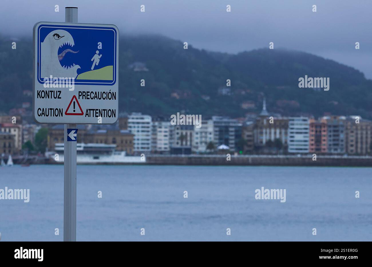 Cute caution sign on San Sebastian promenade, Spain Stock Photo - Alamy