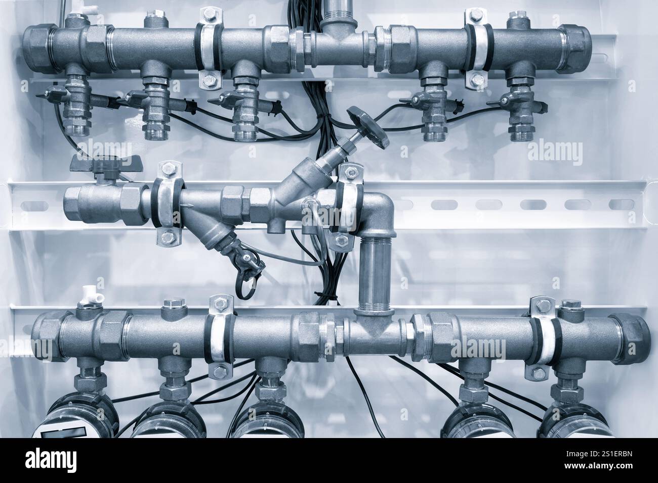 pipes and faucet valves of heating system in a boiler room Stock Photo ...
