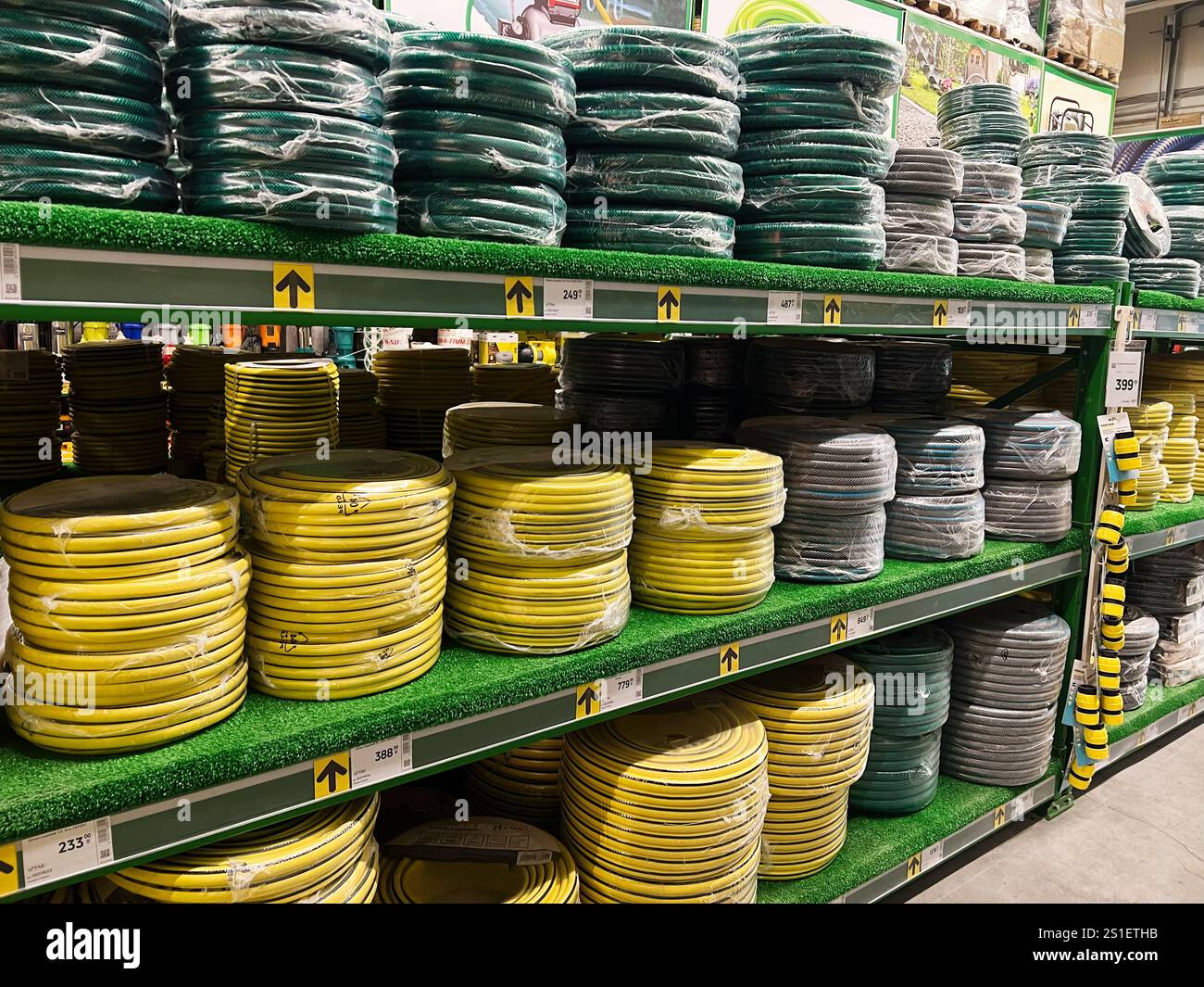 Kyiv, Ukraine - January 03, 2025: Rows of colorful garden hoses in ...