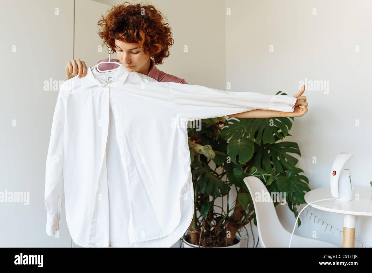 iron things with steam iron, steamer Stock Photo - Alamy