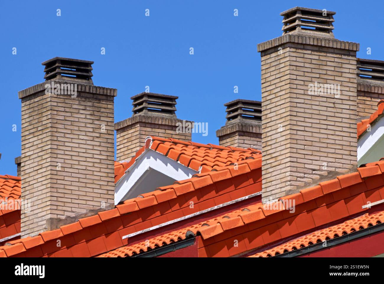 Red tiles roof with chimneys Stock Photo - Alamy